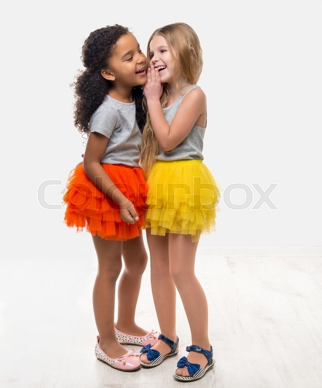 Two little pretty girls in colorful ... | Stock image | Colourbox