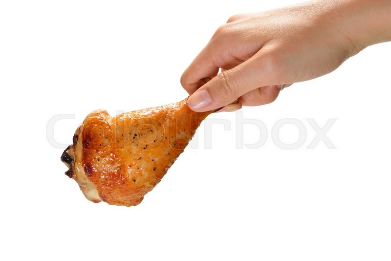 Hand holding grilled chicken leg on ... | Stock image | Colourbox