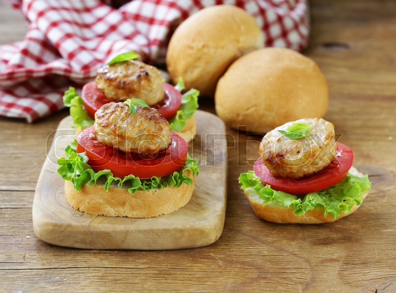 Appetizer mini burgers with tomatoes, ... | Stock image | Colourbox