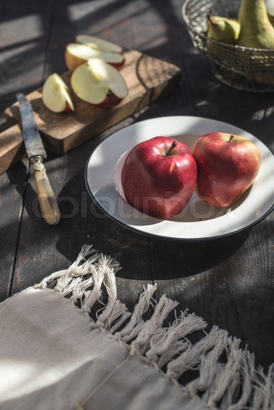 Sliced apples on a plate. Authentic ... | Stock image | Colourbox