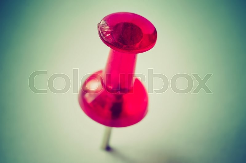 Red pin in a board macro | Stock image | Colourbox