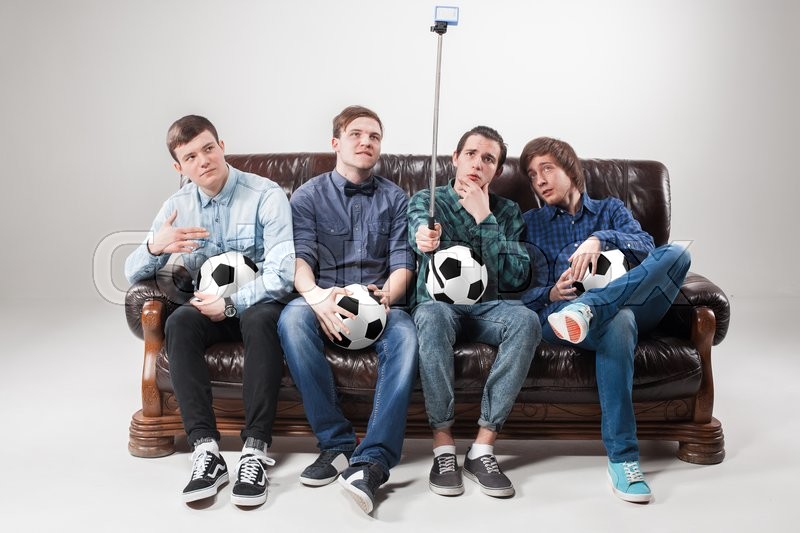 A portrait of a four guys with balls ... | Stock image | Colourbox