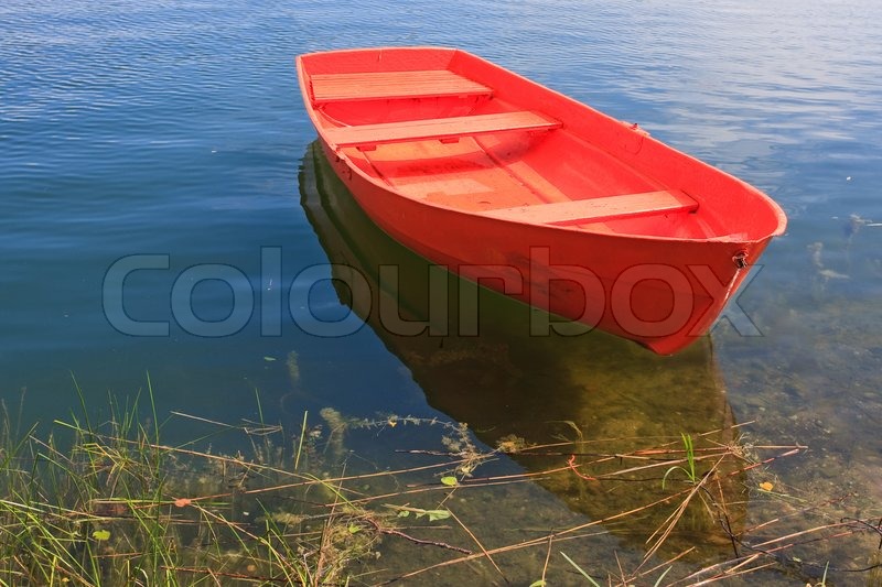 Red rowing boat on a lake | Stock image | Colourbox