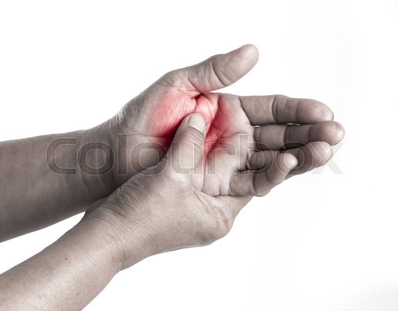 Senior woman touching her injured hand ... | Stock image | Colourbox