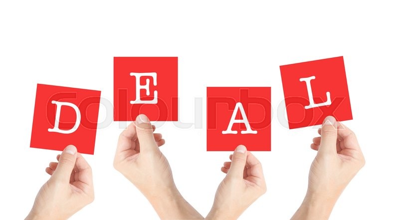 Deal written on cards held by hands | Stock image | Colourbox