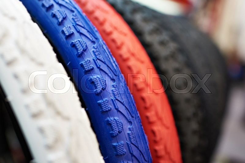 New bicycle tires with different color ... | Stock image | Colourbox