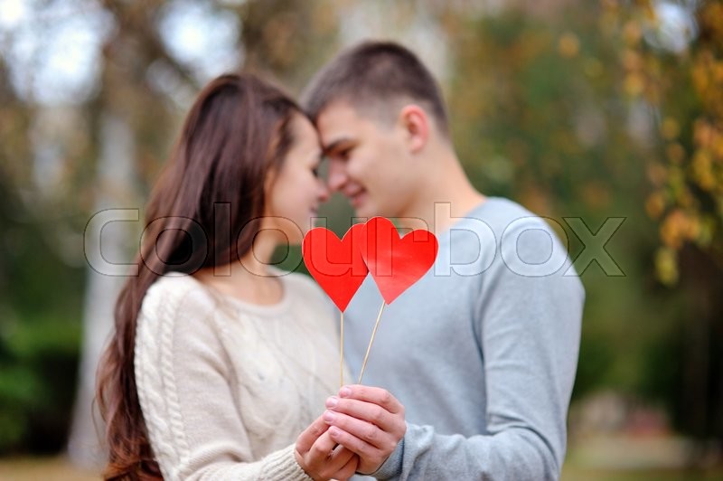 Loving couple with red heart in the ... | Stock image | Colourbox