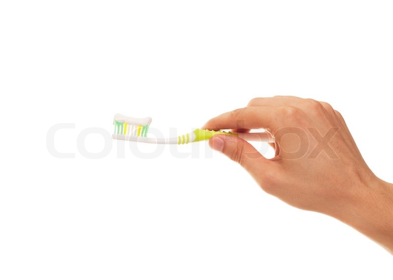 Hand with toothbrush isolated over ... | Stock image | Colourbox