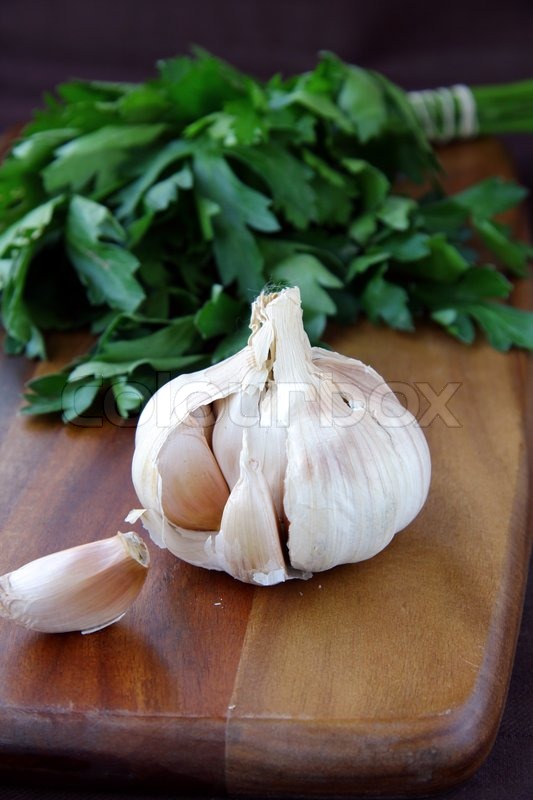 Cutting garlic close up shoot | Stock image | Colourbox