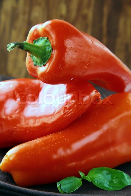 Drei rote Paprika auf einander auf einem ... | Stock Bild | Colourbox