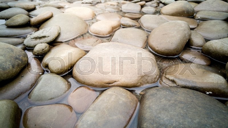 Closeup photo of big round stones in ... | Stock image | Colourbox