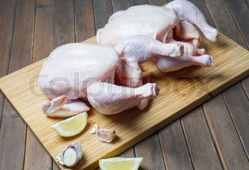 Whole raw Chicken on rustic wooden ... | Stock image | Colourbox