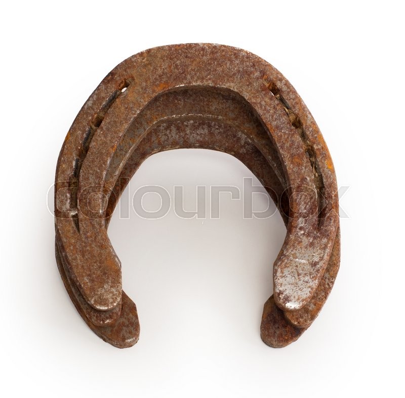 Stack of old rusty horseshoes, isolated ... | Stock image | Colourbox