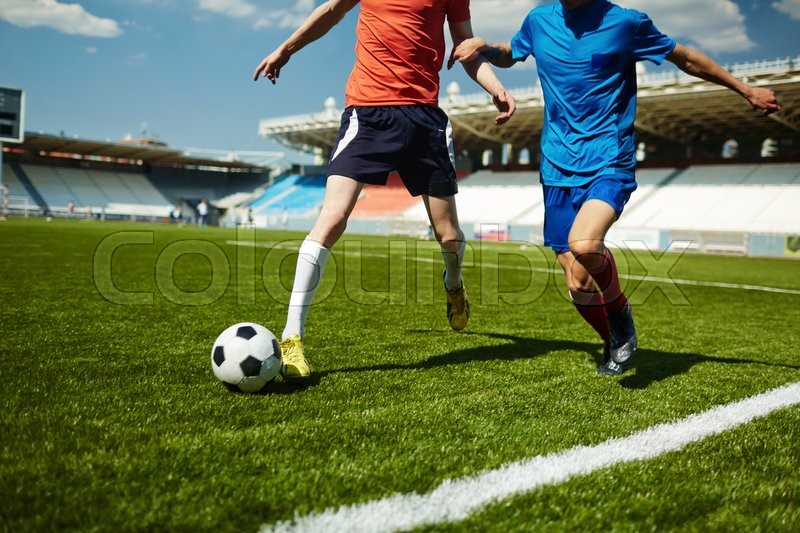 Intense fight of two football players ... | Stock image | Colourbox
