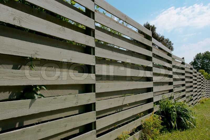 Green painted fence, photographed with ... | Stock foto | Colourbox