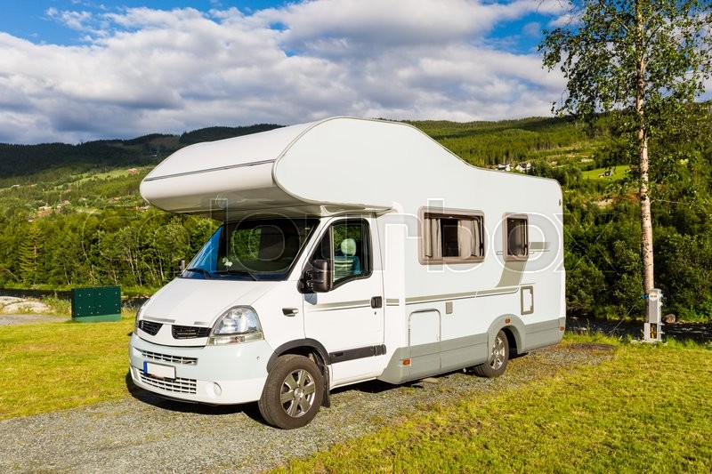 Modern white campervan at camping site ... | Stock Photo | Colourbox