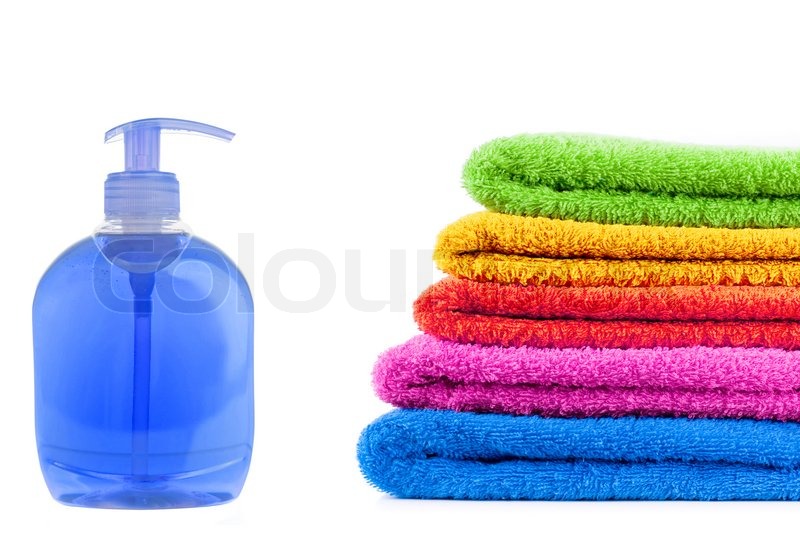 Blue soap bottle and stacked colorful ... | Stock image | Colourbox