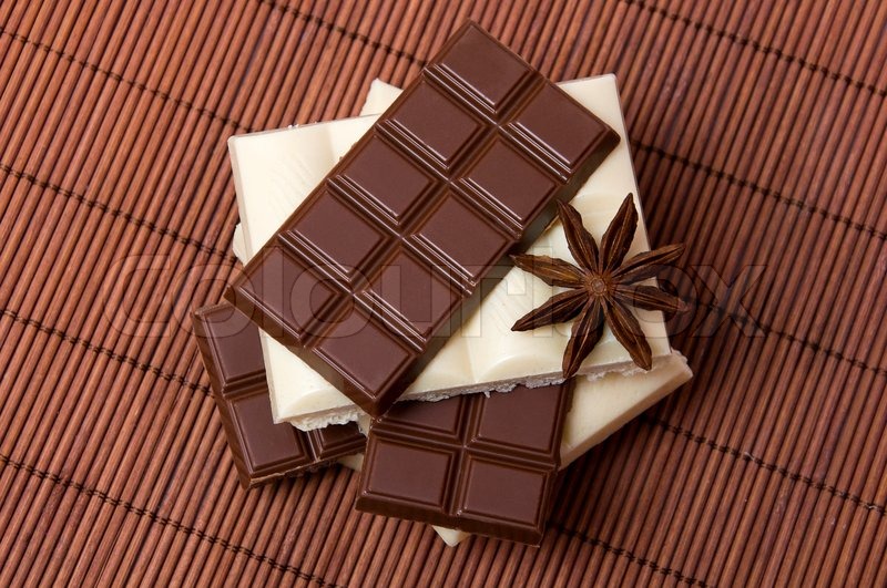 Slices of black and white chocolate ... | Stock Photo | Colourbox