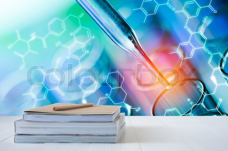 Book stack on white table with science ... | Stock image | Colourbox