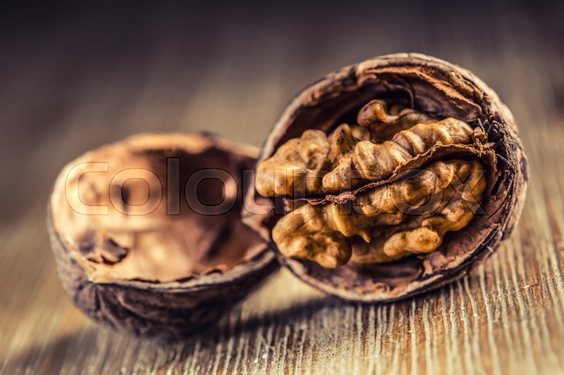 Walnut kernels and whole walnuts on ... | Stock image | Colourbox