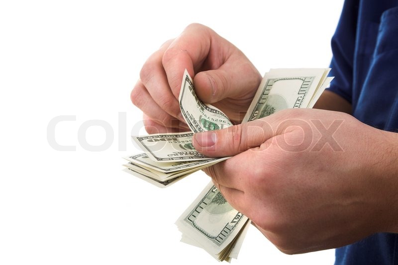 Man's hand counting money isolated on white | Stock Photo | Colourbox