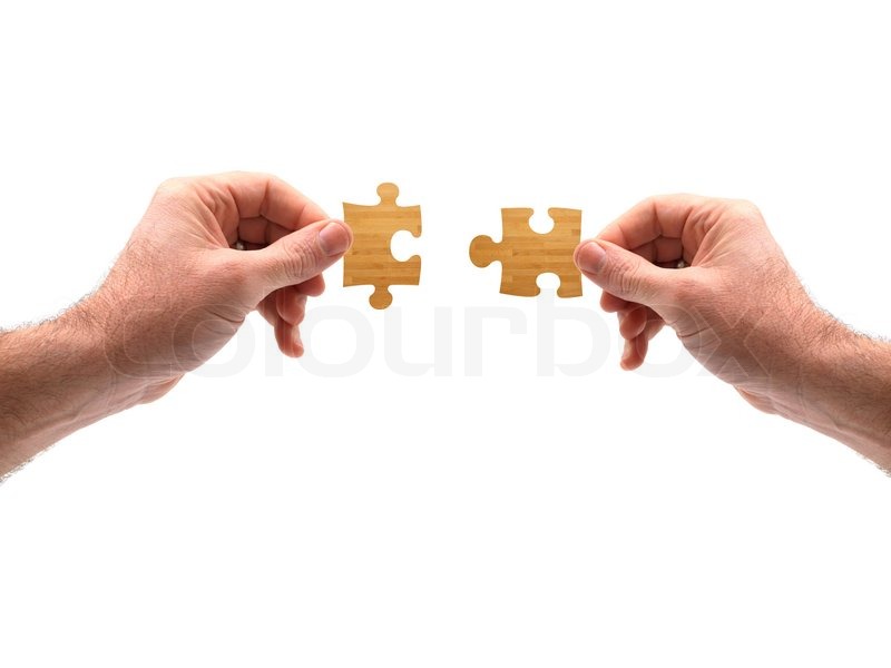 Wooden jigsaw pieces being put together ... | Stock image | Colourbox