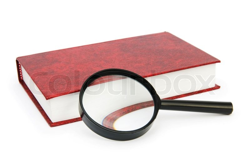 Magnifying glass over the stack of ... | Stock image | Colourbox