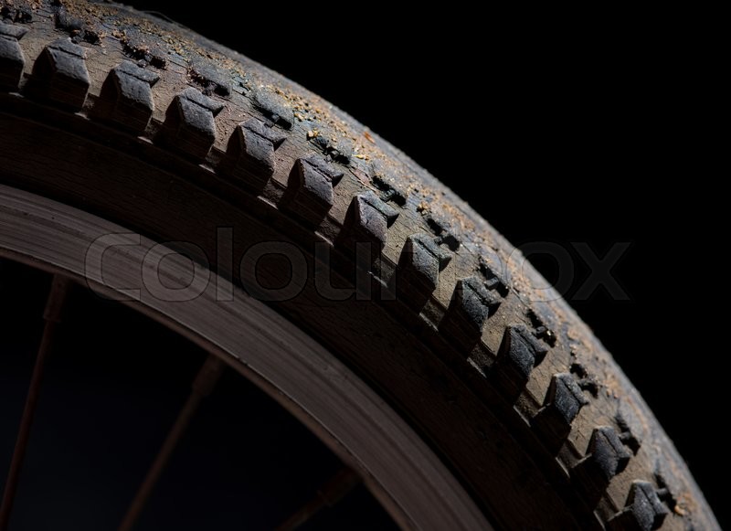 Bike tire pattern on dark ... | Stock image | Colourbox