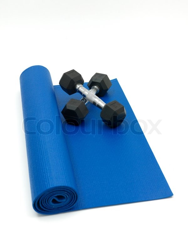An exercise mat and hand weights ... | Stock image | Colourbox