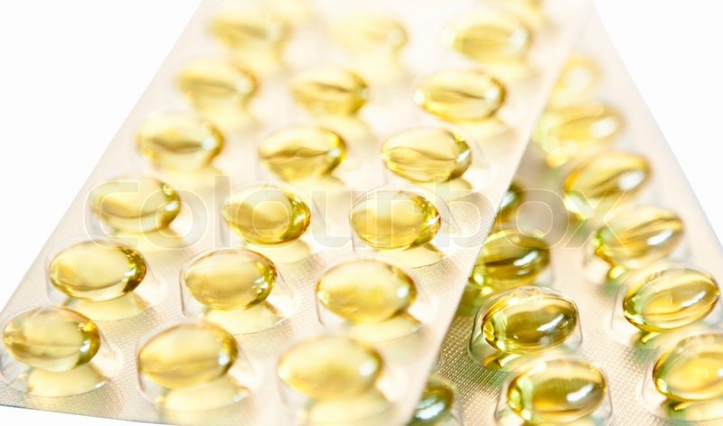 Pack of yellow medicine pills | Stock image | Colourbox