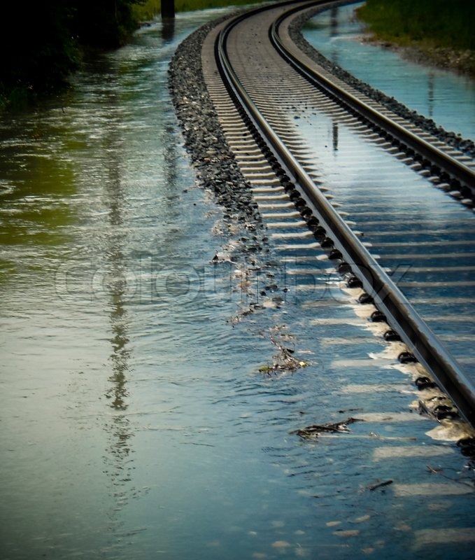 A rail track leads into high water | Stock Photo | Colourbox