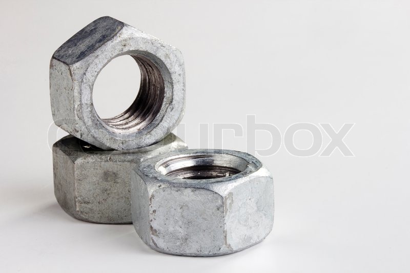 Silver metallic nuts isolated on a ... | Stock image | Colourbox