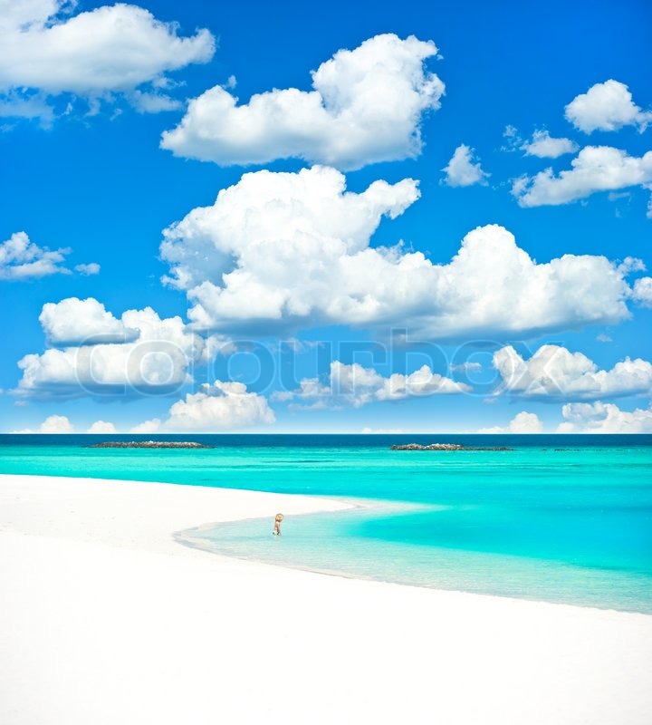 Tropical sand beach over cloudy sky. ... | Stock image | Colourbox
