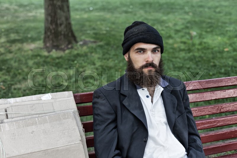 Bearded vagrant sitting on the bench | Stock image | Colourbox