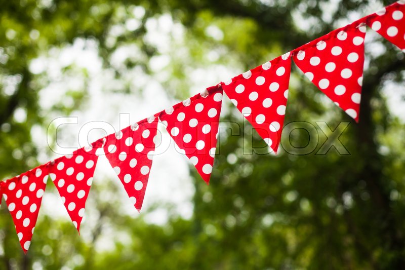 Red triangular flags with white dots on ... | Stock image | Colourbox