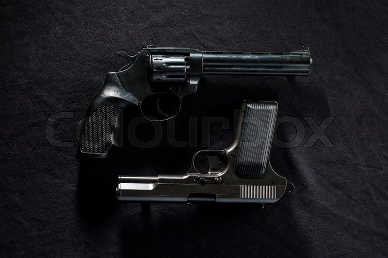 Two old revolvers on black background. | Stock image | Colourbox