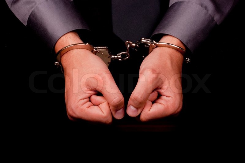 Close-up of hands handcuffed, arrested ... | Stock image | Colourbox