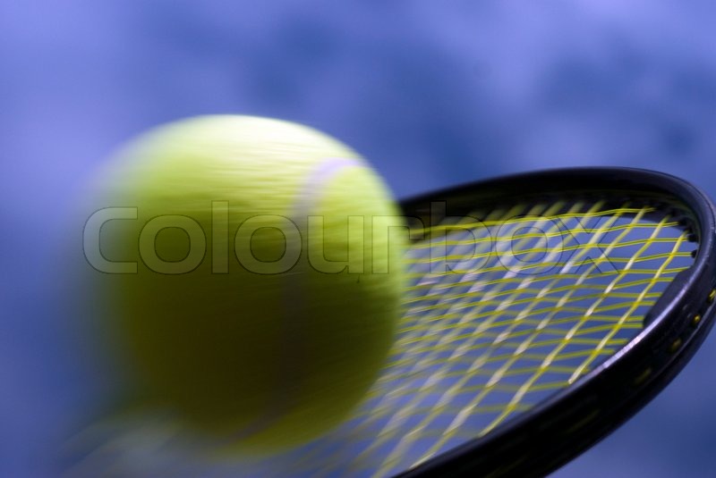 Speedy tennis ball on racket closeup ... | Stock image | Colourbox