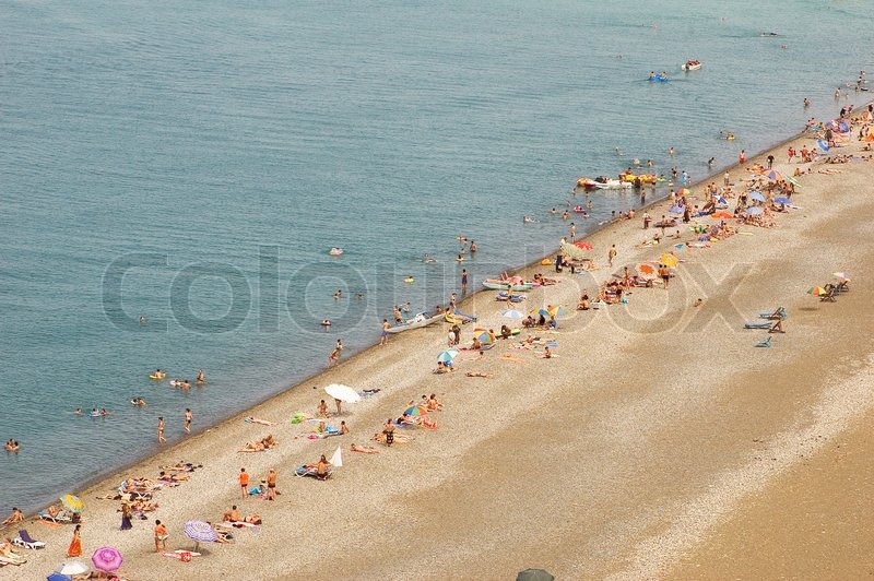 Beach with many people during summer ... | Stock image | Colourbox