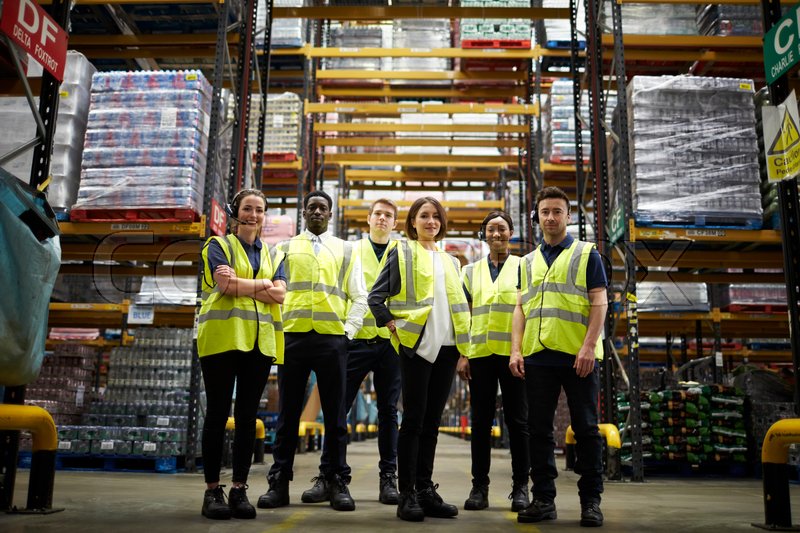 Group portrait of staff at distribution ... | Stock image | Colourbox