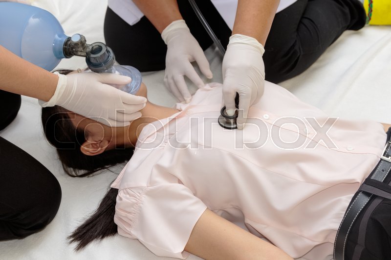 Medical team is giving first aid to ... | Stock image | Colourbox