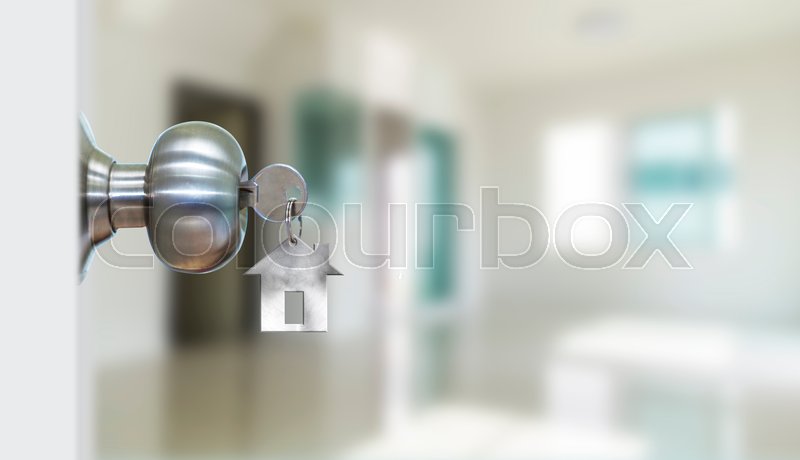 Open door with keys, key in keyhole | Stock image | Colourbox