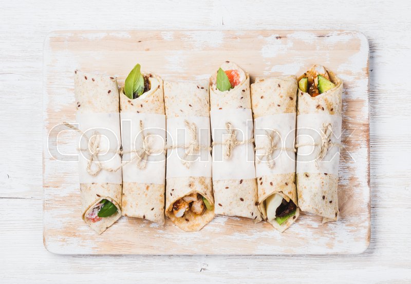 Tortilla wraps with various fillings on ... | Stock image | Colourbox