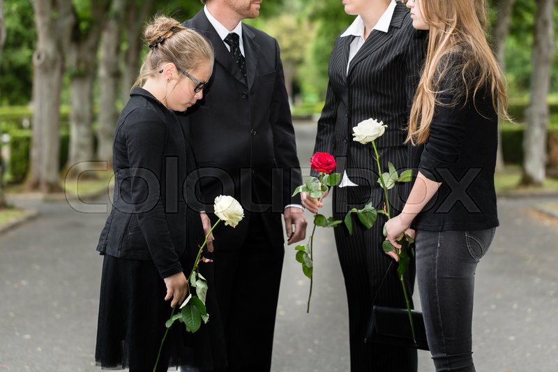 Family mourning on funeral at cemetery ... | Stock image | Colourbox