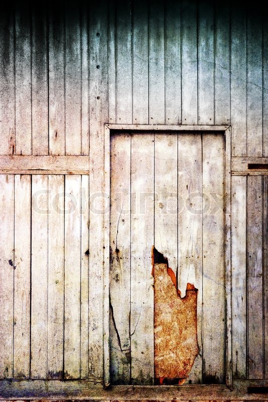 An old and damaged wood door | Stock image | Colourbox