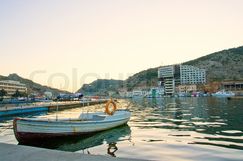 Wooden boat at the dock in the bay is ... | Stock image | Colourbox