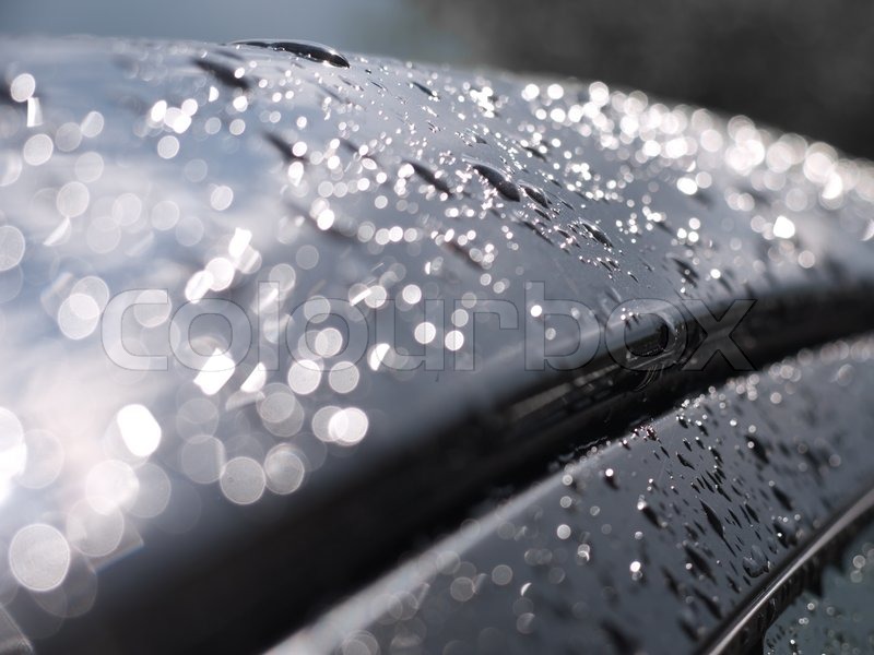 Waterdrops on a car with sun reflection | Stock image | Colourbox