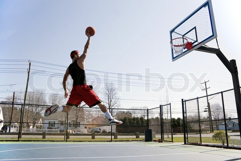 A young basketball player flying ... | Stock image | Colourbox