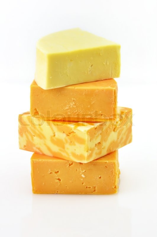 Assortment of cheese blocks on a white background | Stock Photo | Colourbox