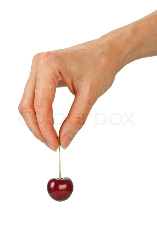 Hand holding red cherry against white ... | Stock image | Colourbox